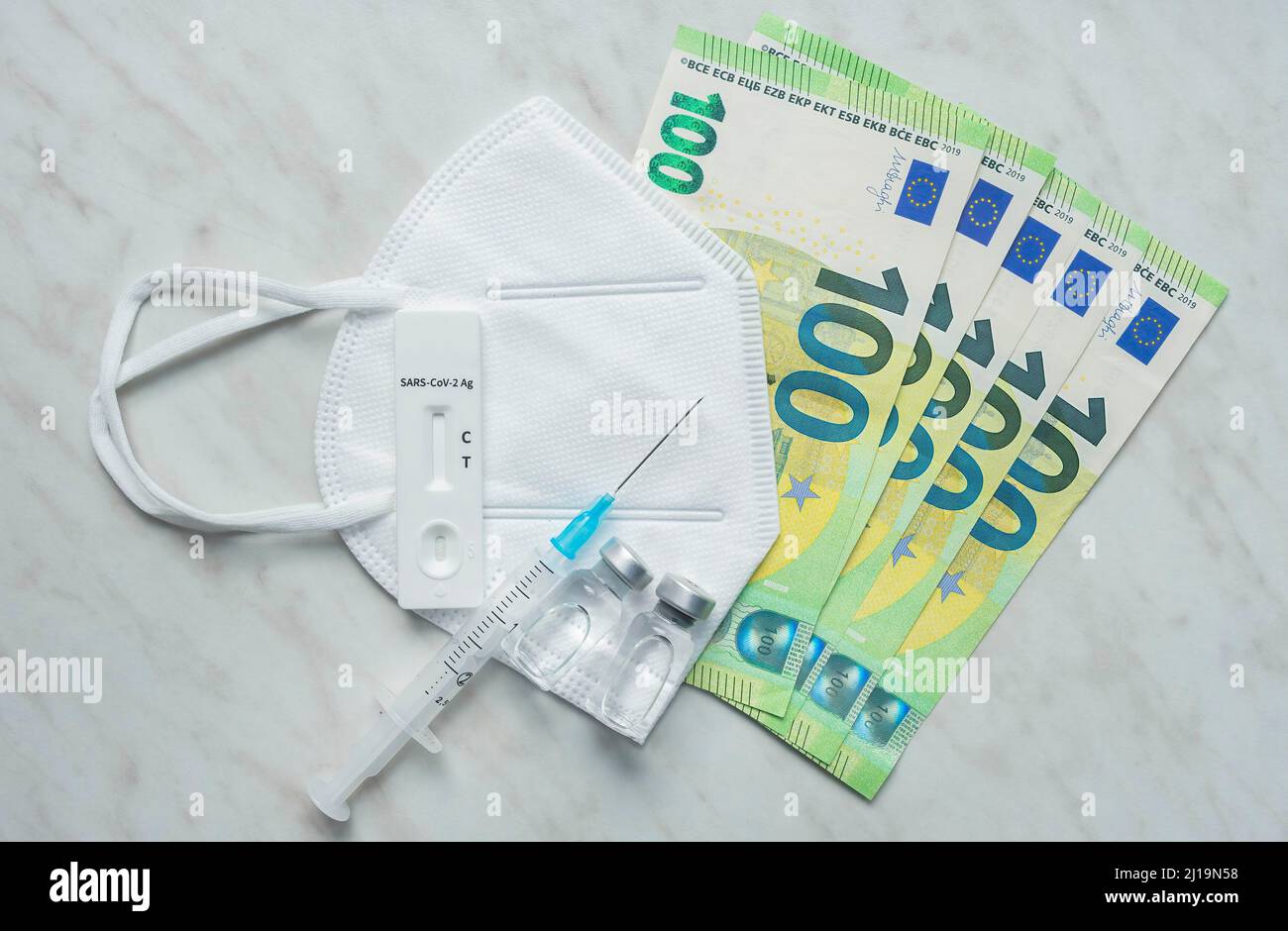 Money (Euro currency banknotes) with medical mask, antigen test ...