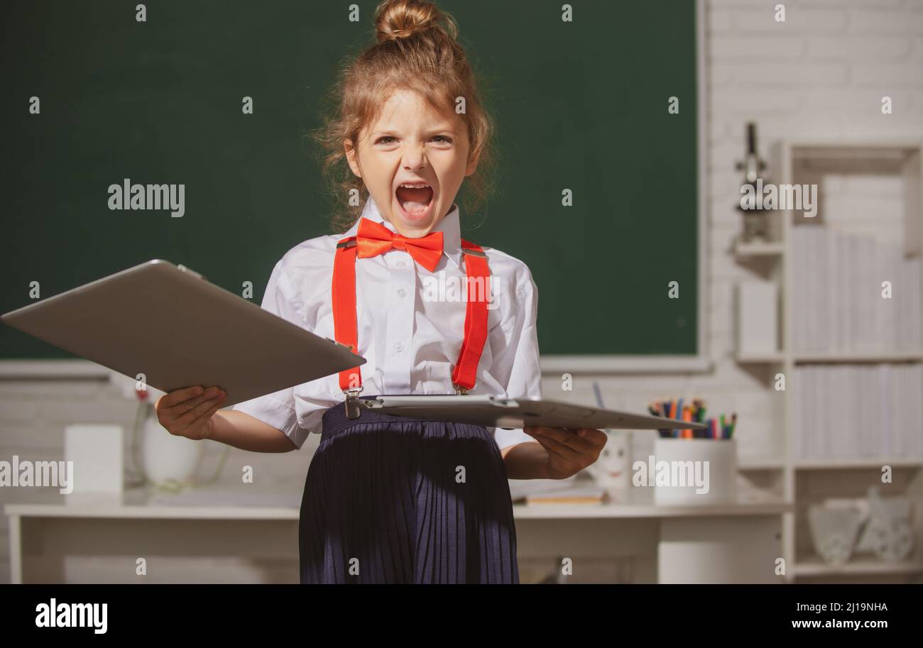 Bad angry school girl vs distance education. Sad kid broken online ...