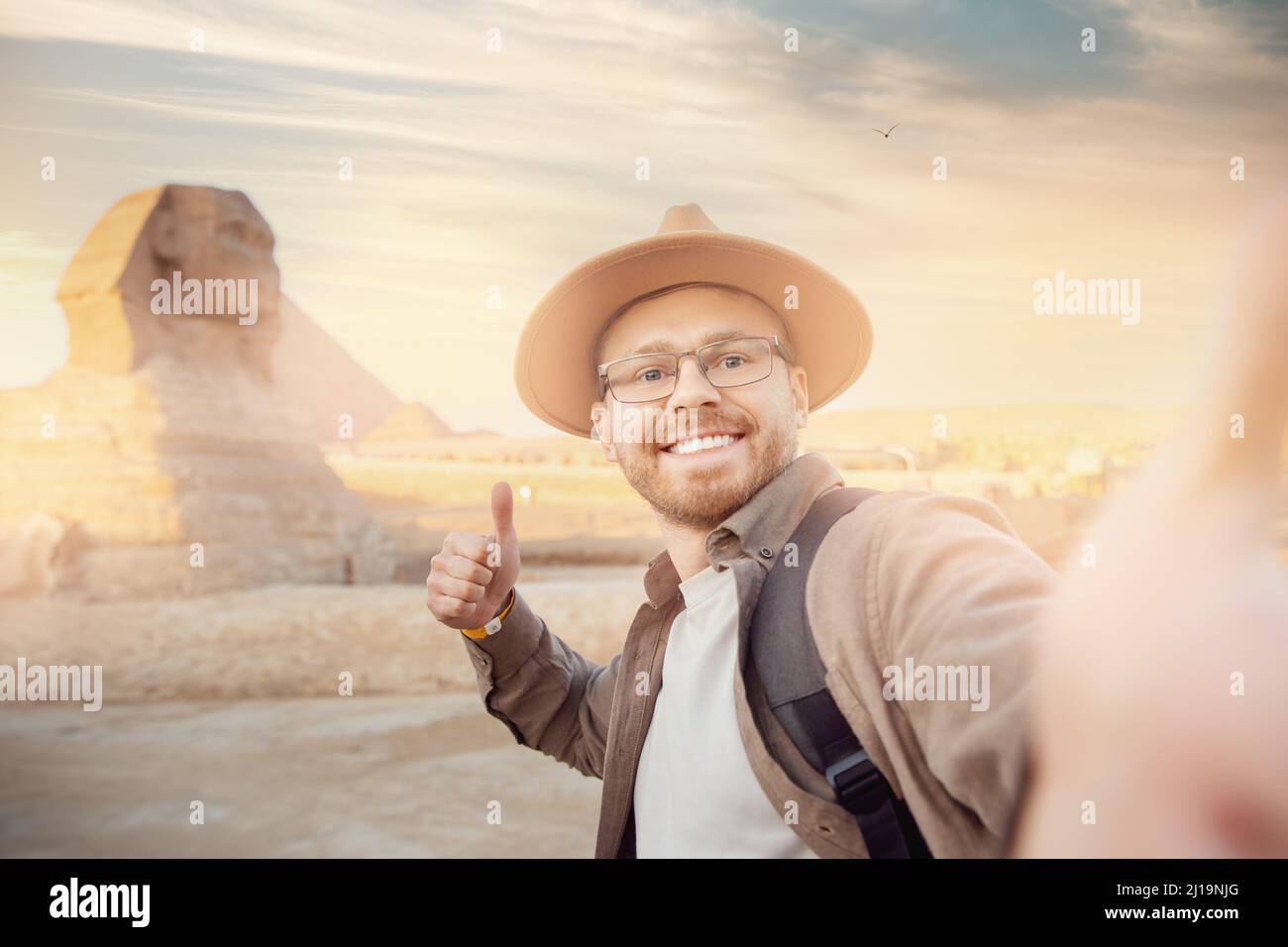 Travel Selfie photo man in hat background pyramid of Egyptian Giza and ...