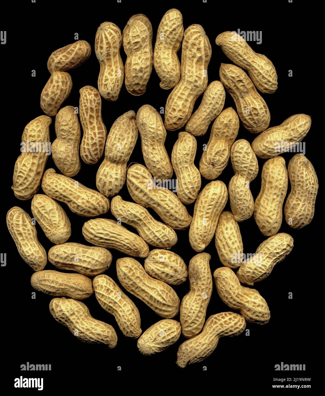 Peanuts on black background Stock Photo - Alamy