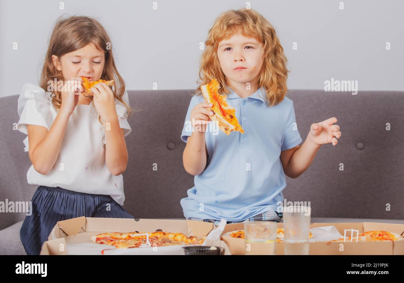 Pizza and kids, slices pizza in kids hand. Children girl and boy eating ...