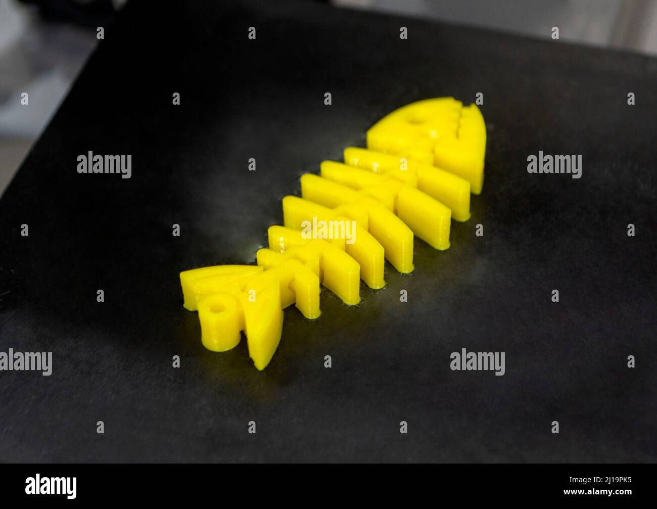 Yellow objects printed on 3D printer from plastic. New 3D printing ...