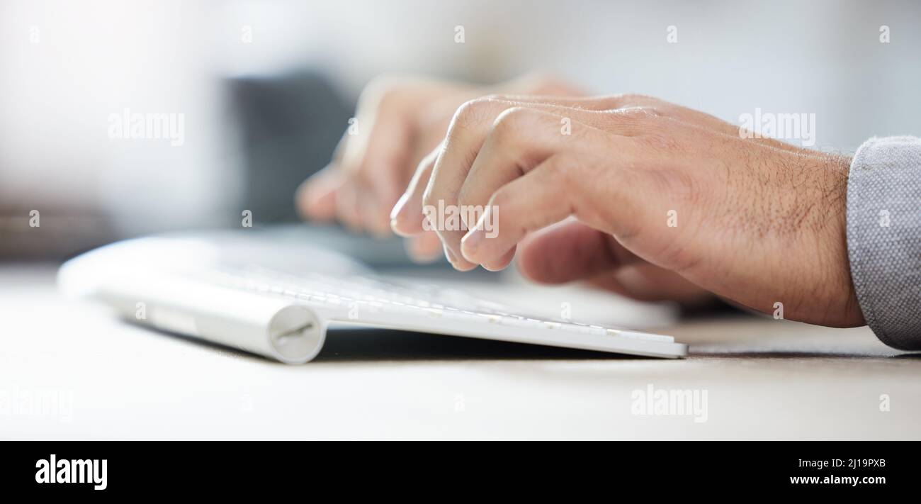 This is my dream keyboard. Shot of a businessman typing on his keyboard ...