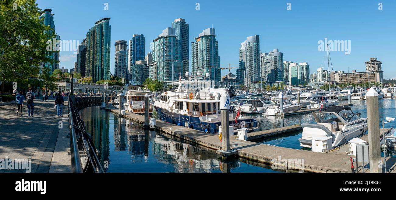 Boats in the marina, high-rise buildings on the promenade, Coal Harbour ...