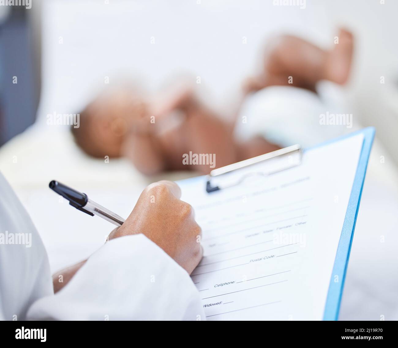 My littlest patients are the cutest. Shot of a doctor making notes ...