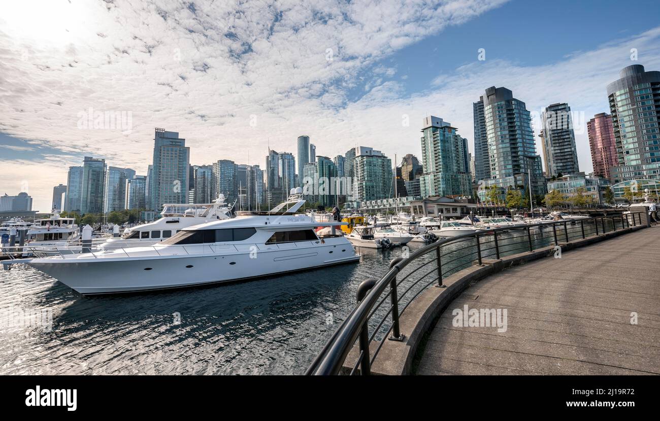 Boats in the marina, high-rise buildings on the promenade, Coal Harbour ...