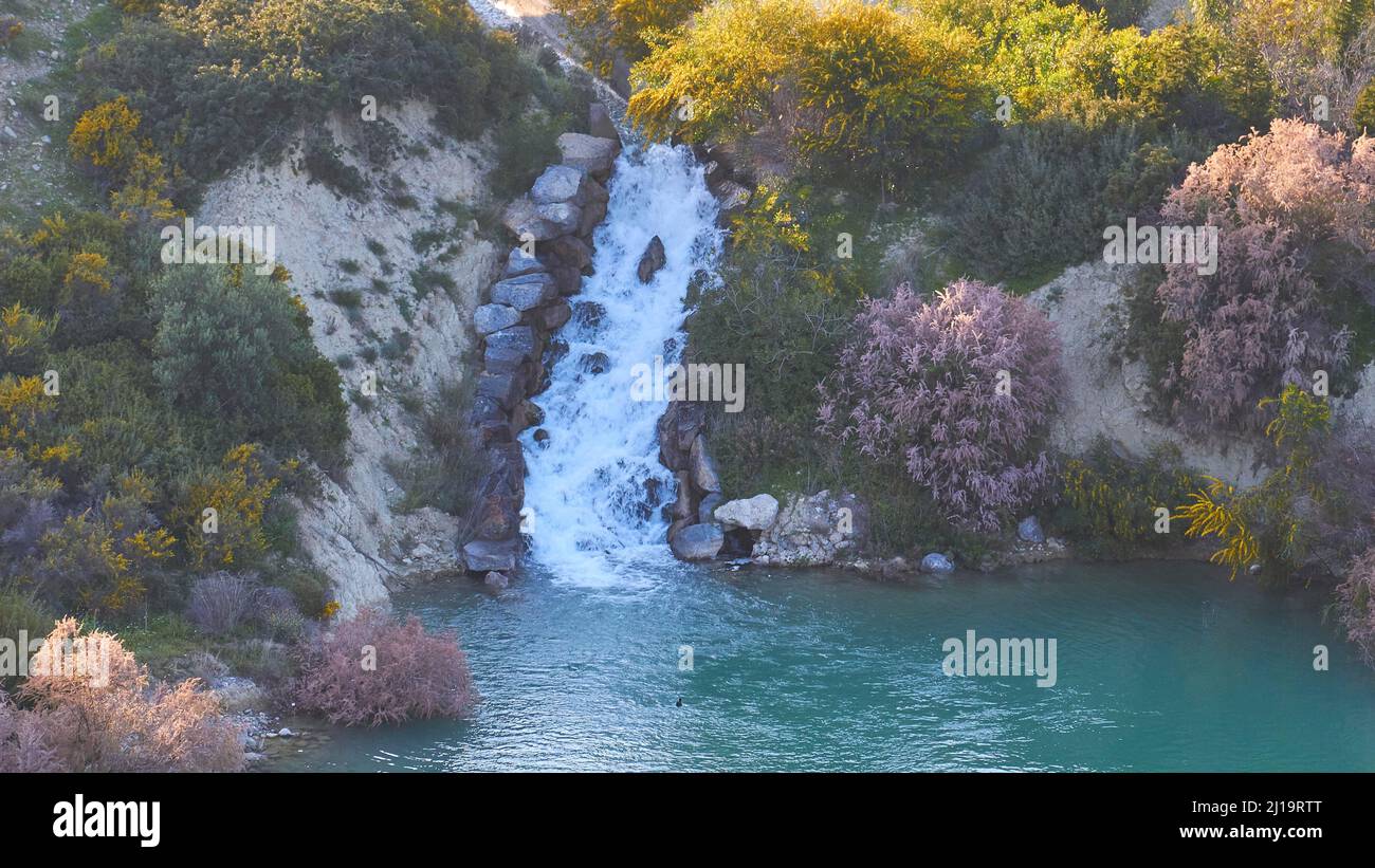 Spring in Crete, flowering shrubs, waterfall, reservoir, Fragma ...