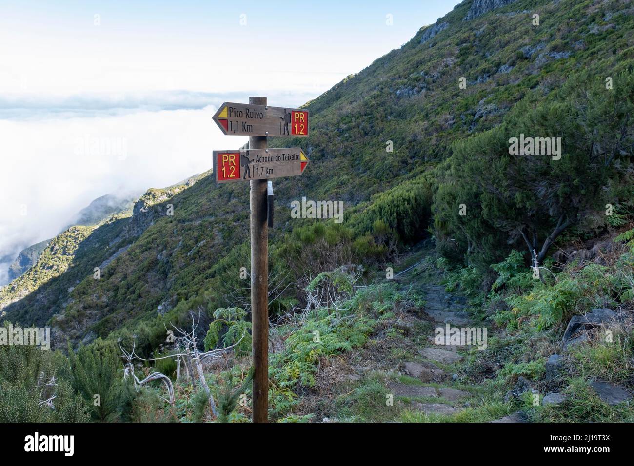 Hiking trail and signpost near the summit of Pico Ruivo, Madeira ...