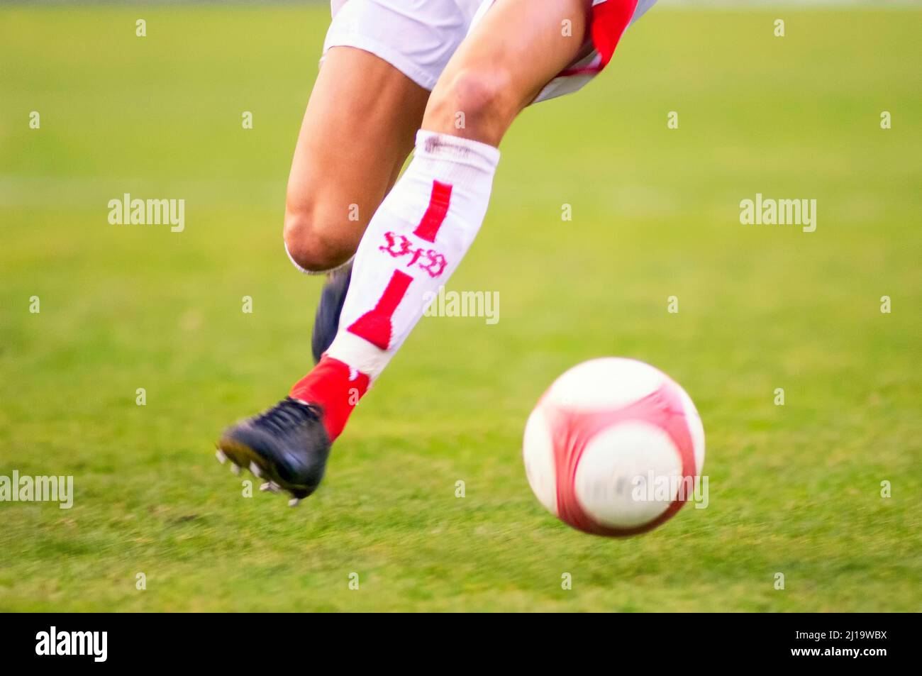 Legs of a running football player, football, motion blur, VFB Stuttgart ...