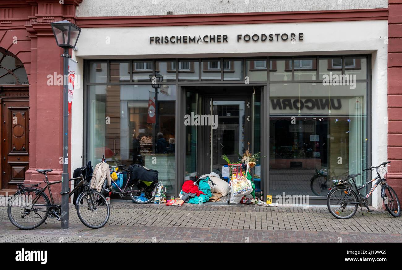 Utensils of homeless people in front of a vacant shop in the old town ...