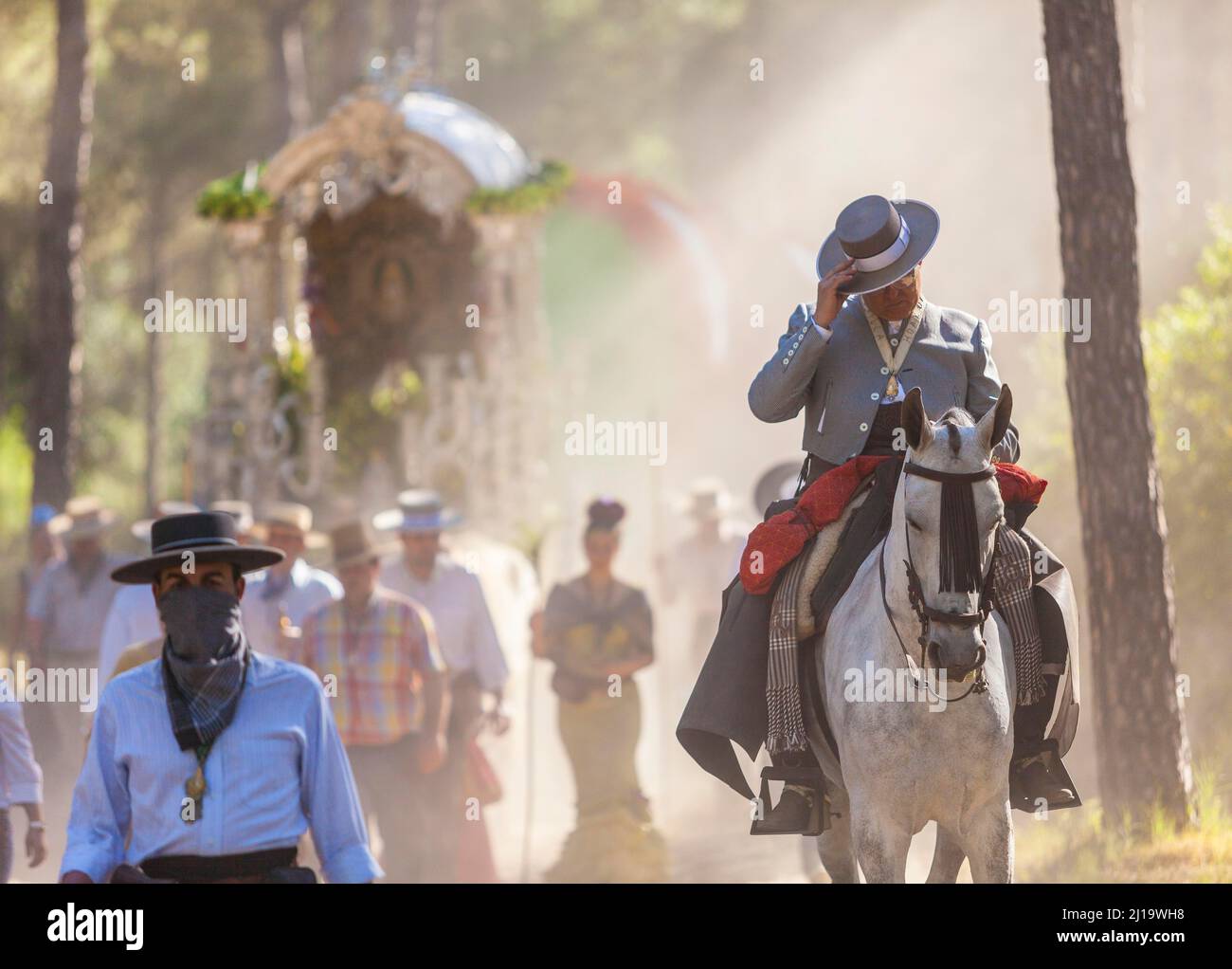 Pilgrims in traditional clothes on their way with the Simpecado and ...
