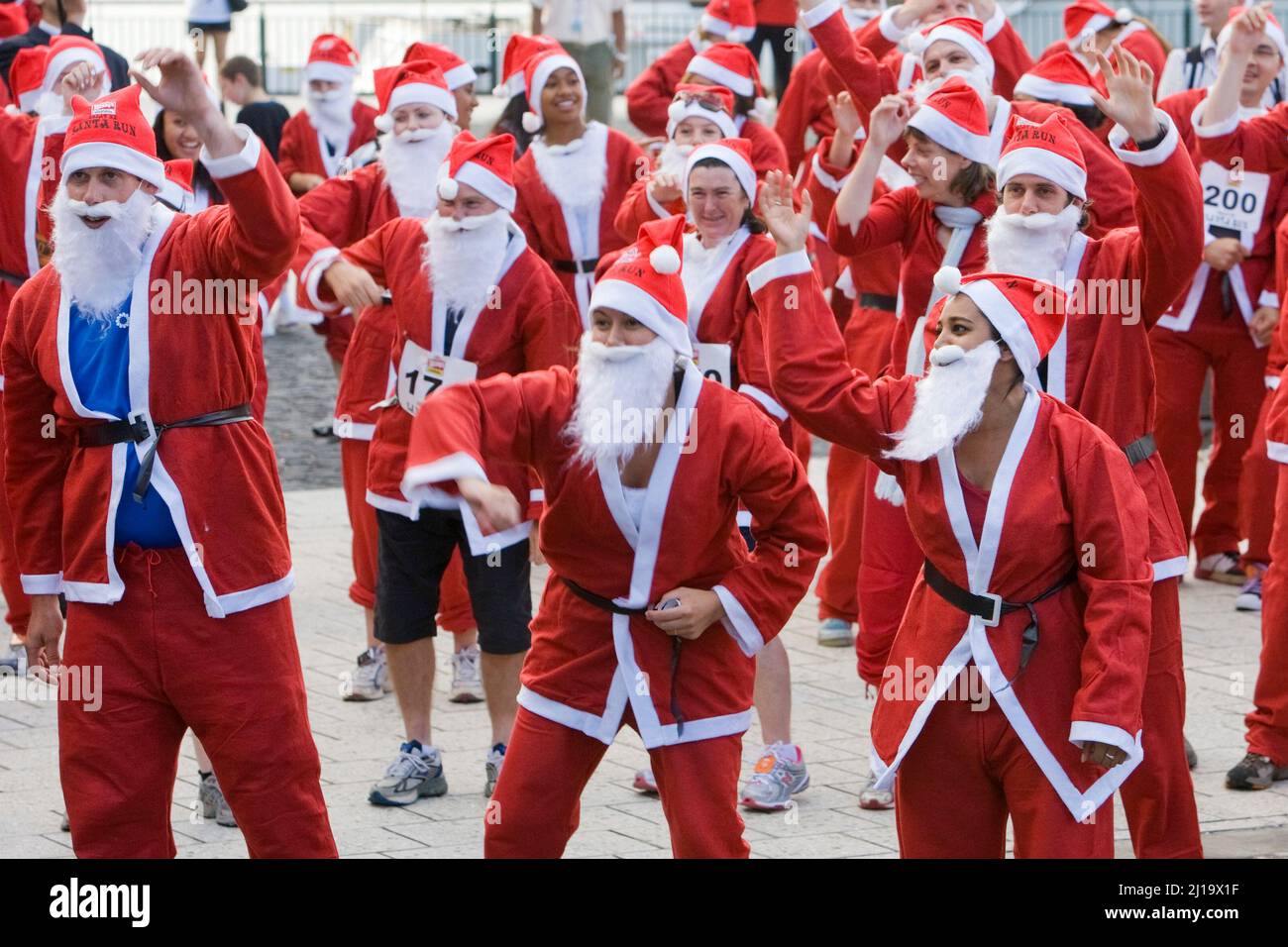 Over 300 Santa's warm up before taking part in the Great New Zealand ...