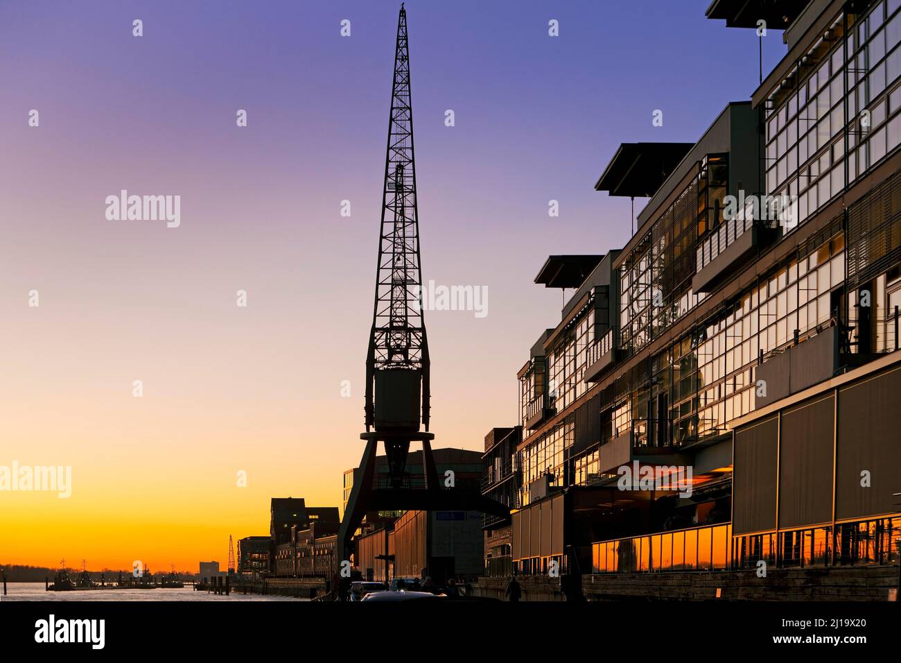 Crane at the fishing harbour at sunset, Altona, Hamburg, Germany Stock ...