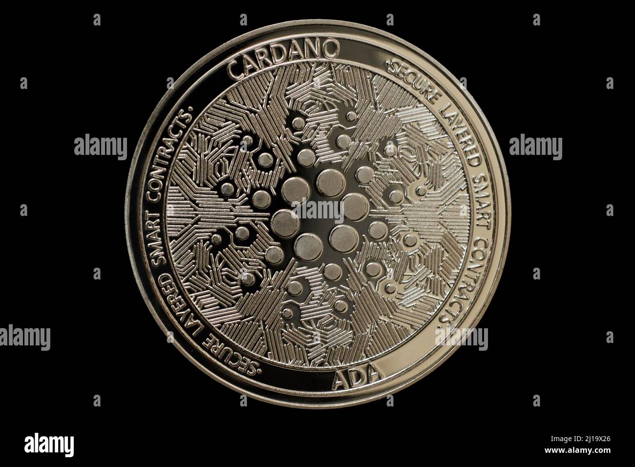 Cardano cryptocurrency coin, studio photography with black background ...
