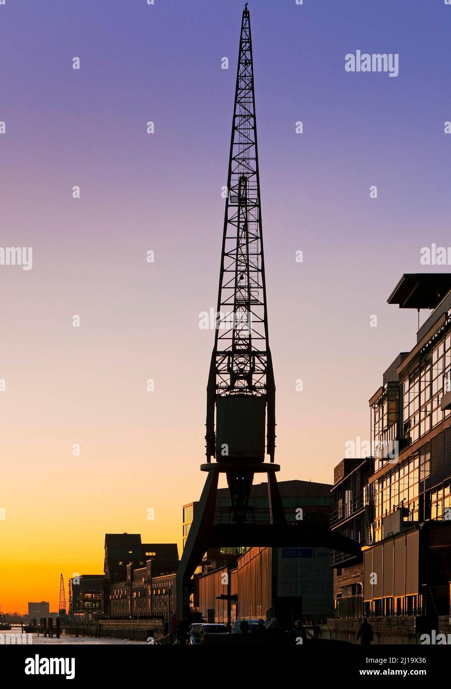 Crane at the fishing harbour at sunset, Altona, Hamburg, Germany Stock ...