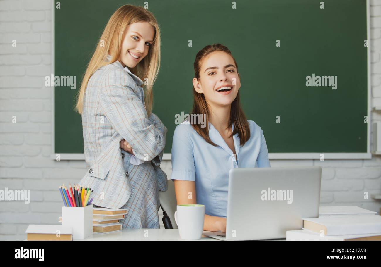 Students girls talking each other in classroom at college. Learning and ...