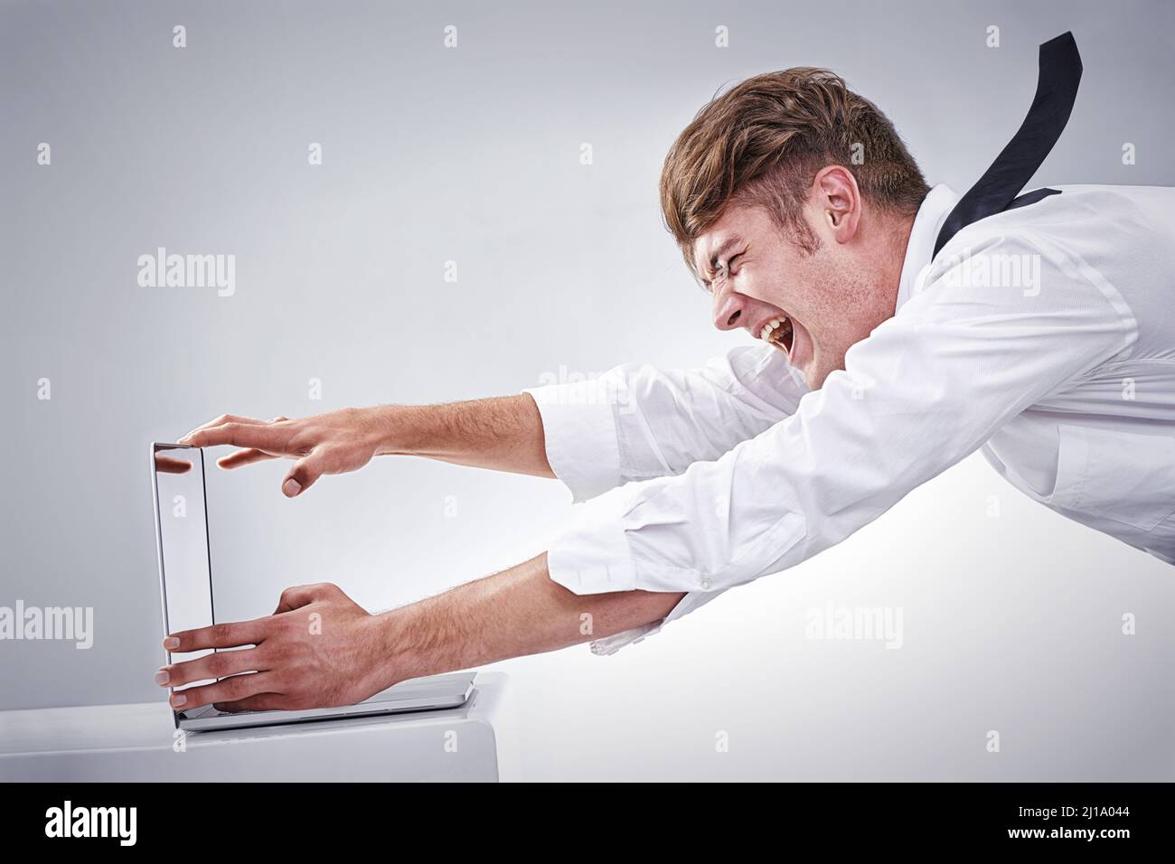Blown away by the work load. Shot of a screaming man being blown away ...