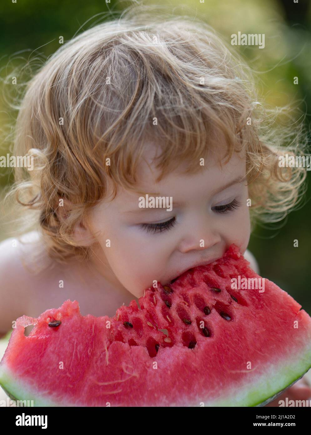 Happy child eating watermelon. Child baby eating watermelon in the ...