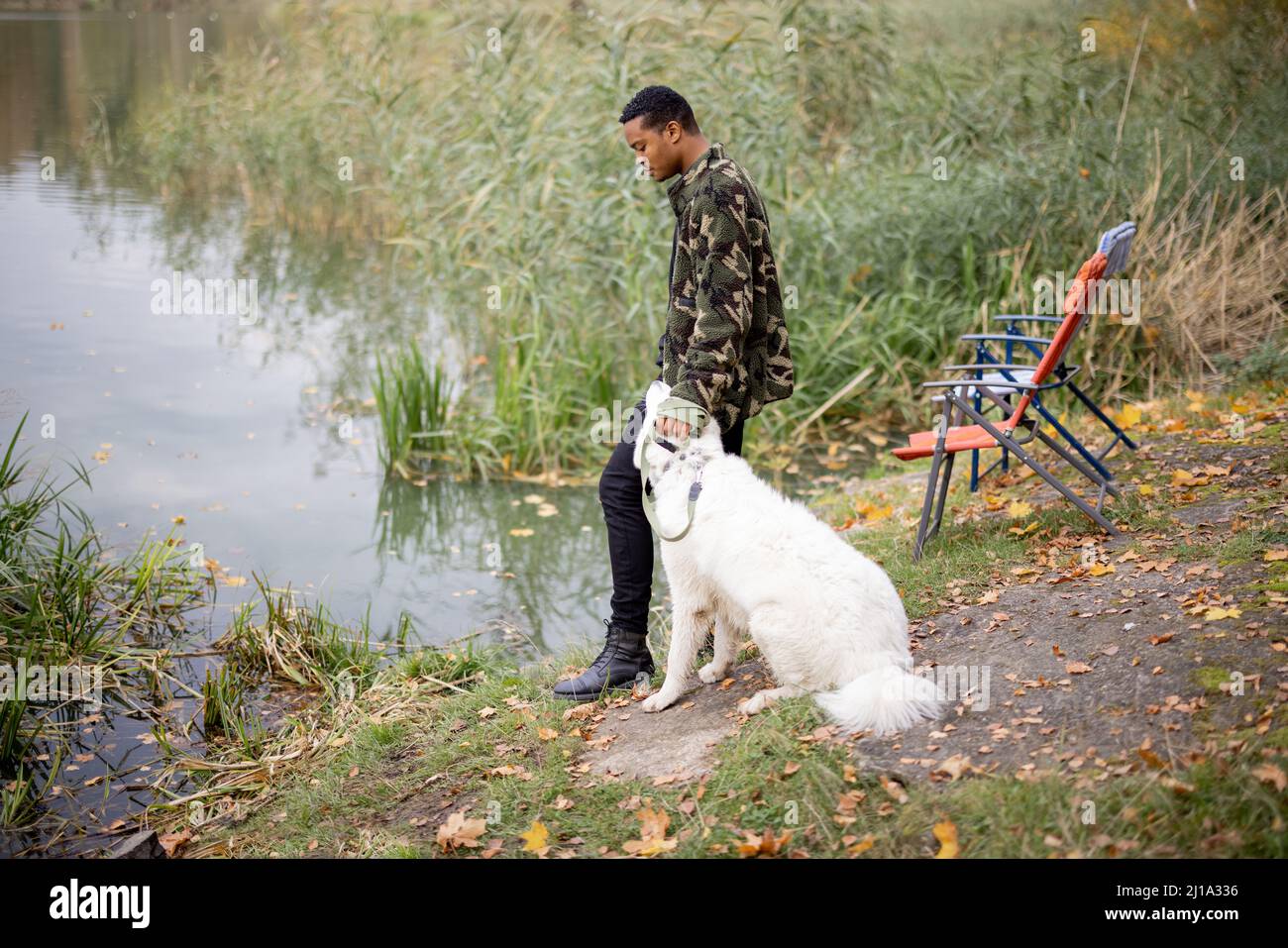 Man fishing with dog hi-res stock photography and images - Alamy
