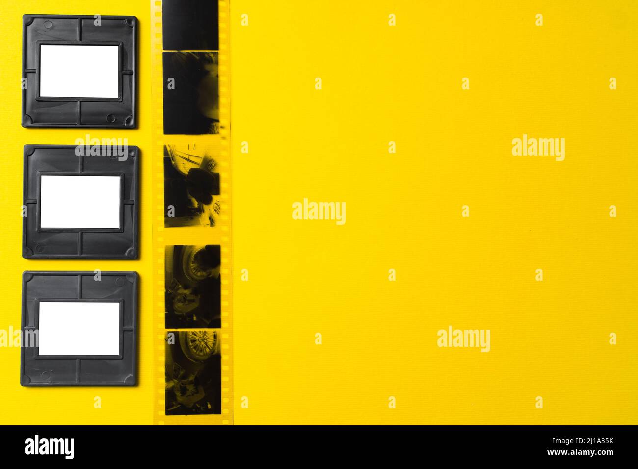 Photography empty slide frames on yellow background Stock Photo - Alamy