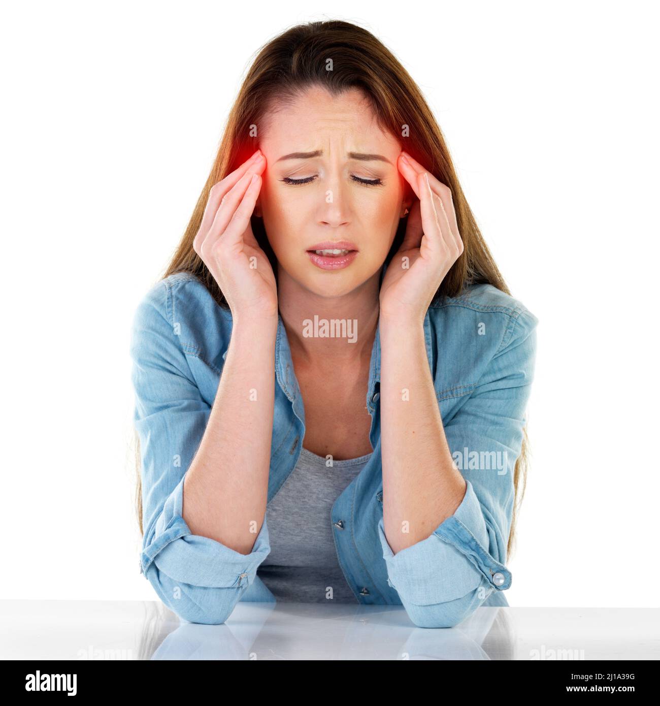 Tension demanding her attention. Studio shot of a young woman ...