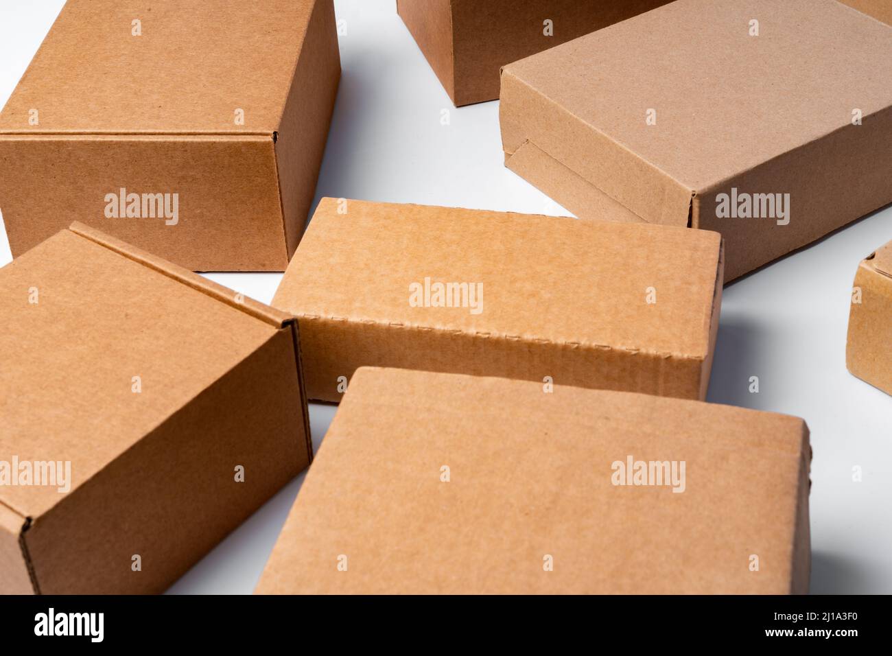 Lot of cardboard boxes on white background Stock Photo - Alamy