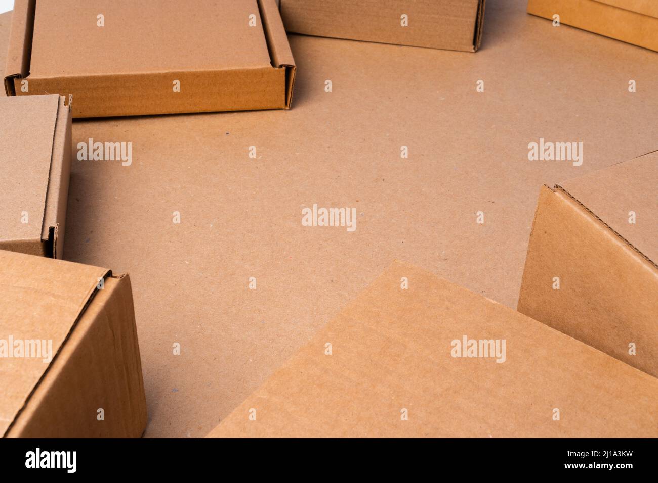 Cardboard box on beige background in studio Stock Photo - Alamy