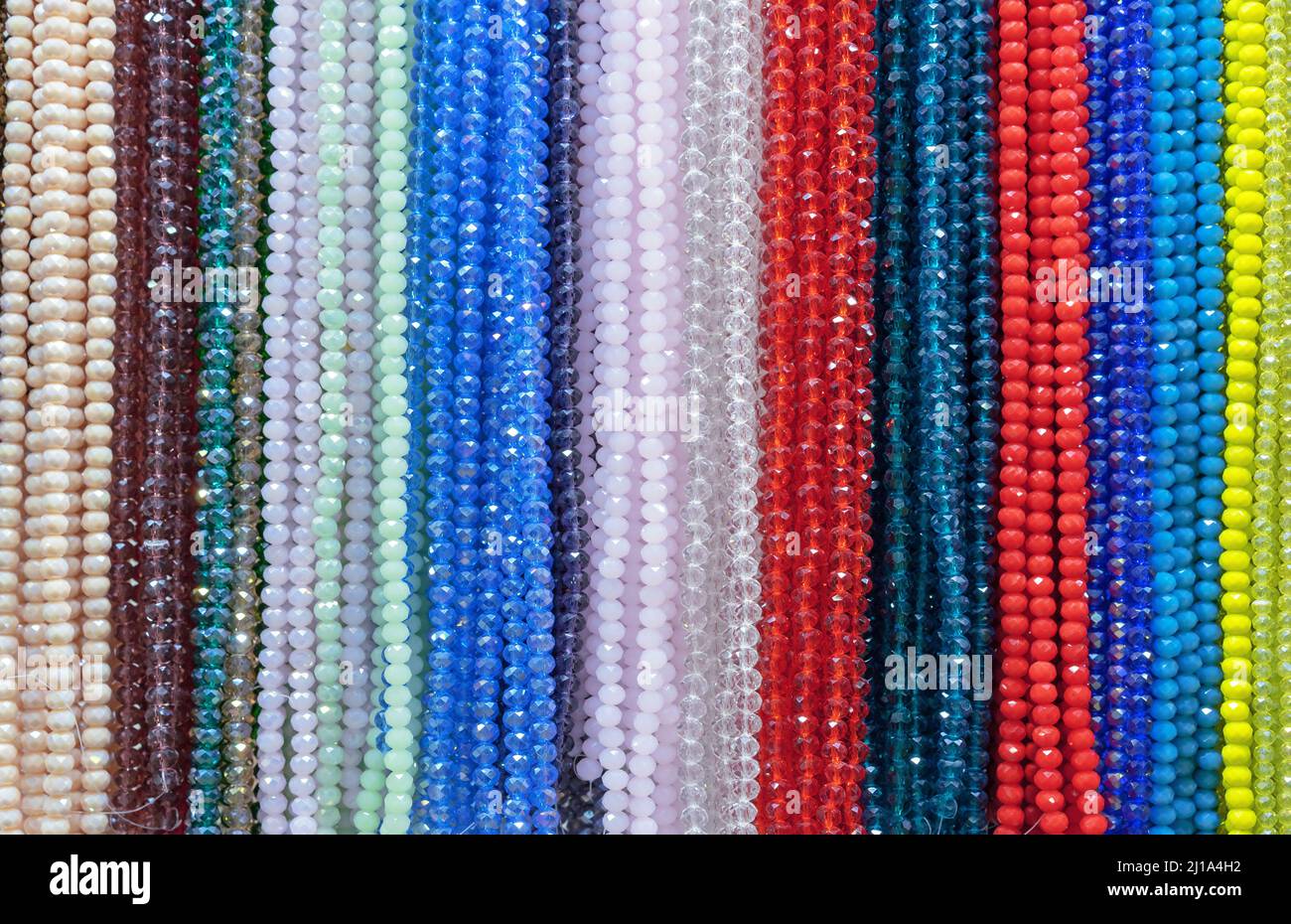 Multi-colored beads from various semi-precious stones Stock Photo - Alamy