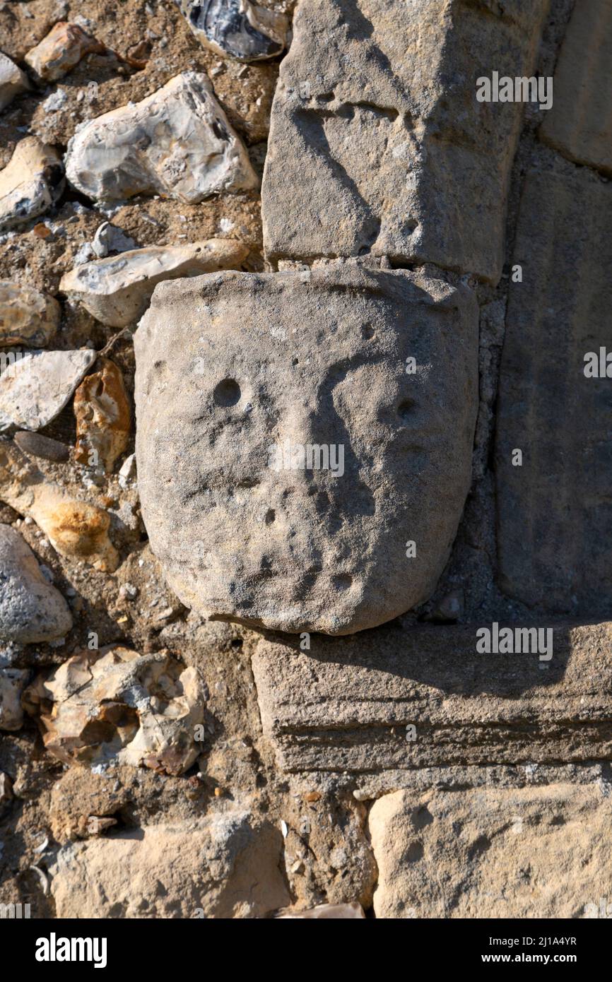 Weathered carved stone face in doorway, Wantisden church, Suffolk ...