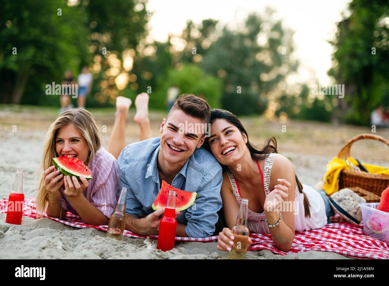 Portrait of friends having fun together on beach vacation. Student ...