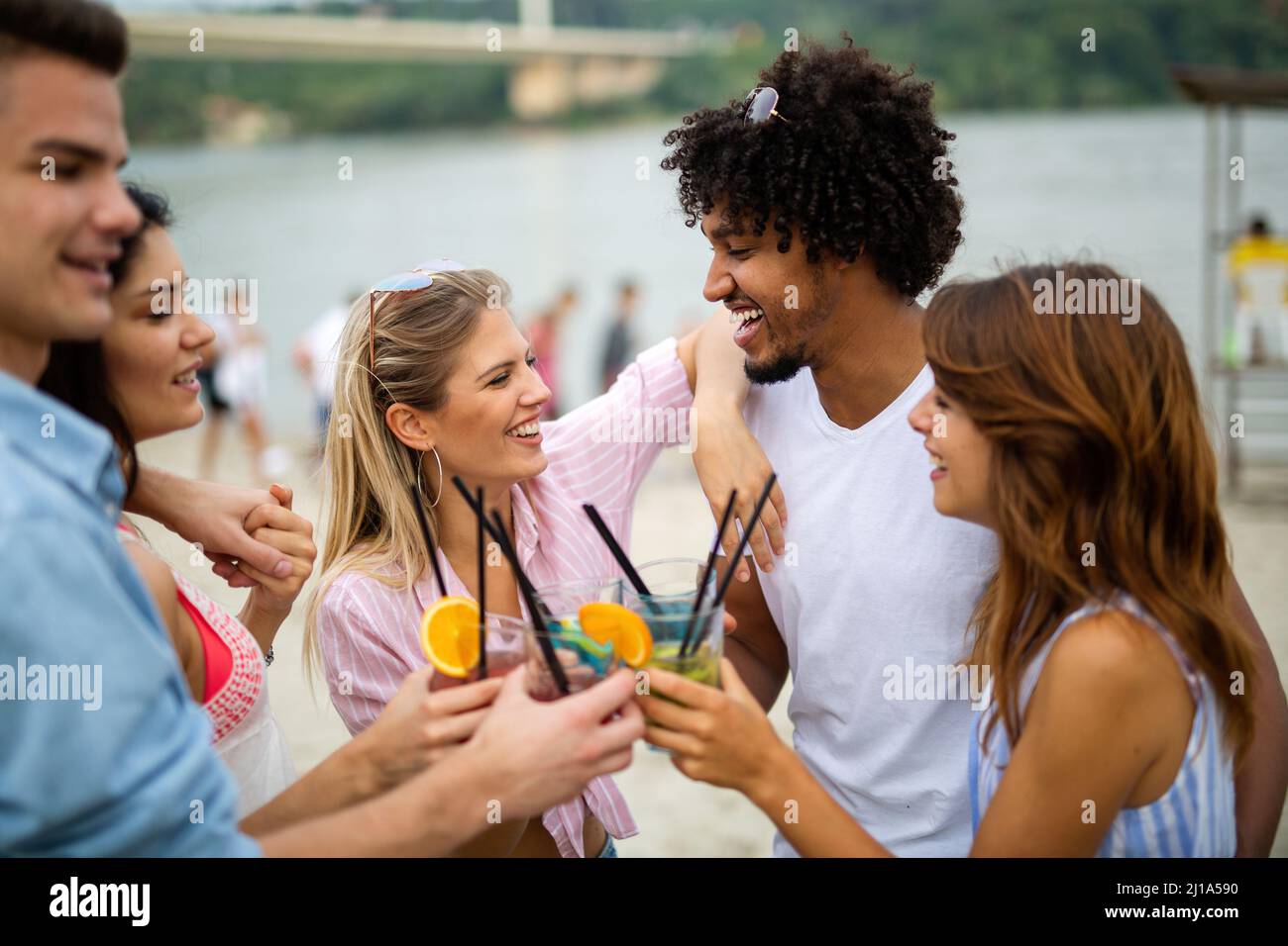 Portrait of friends having fun together on beach vacation. Student ...