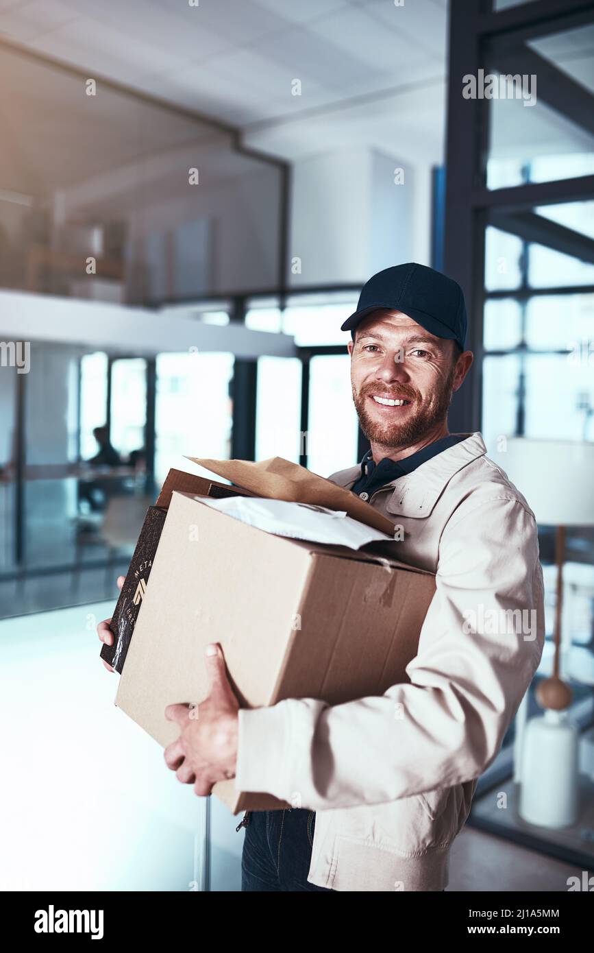 These guys are getting a new home. Portrait of a cheerful young man ...