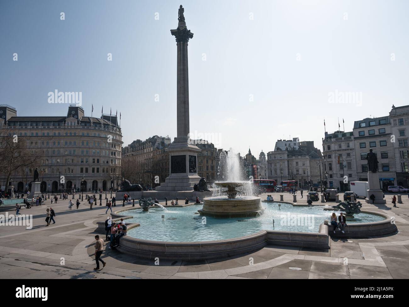 People out and about enjoying a sunny spring day in Trafalgar Square, London, England, UK Stock ...