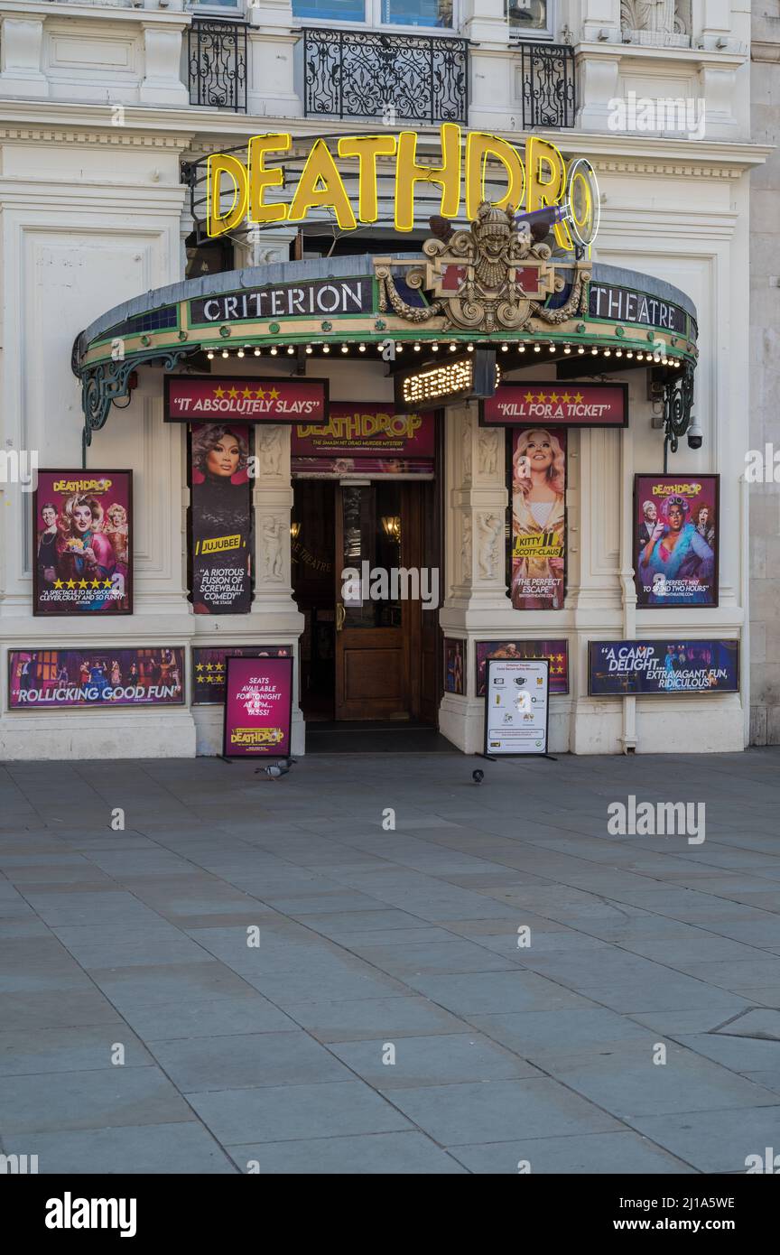 Exterior facade of the Criterion Theatre with marquee and posters ...