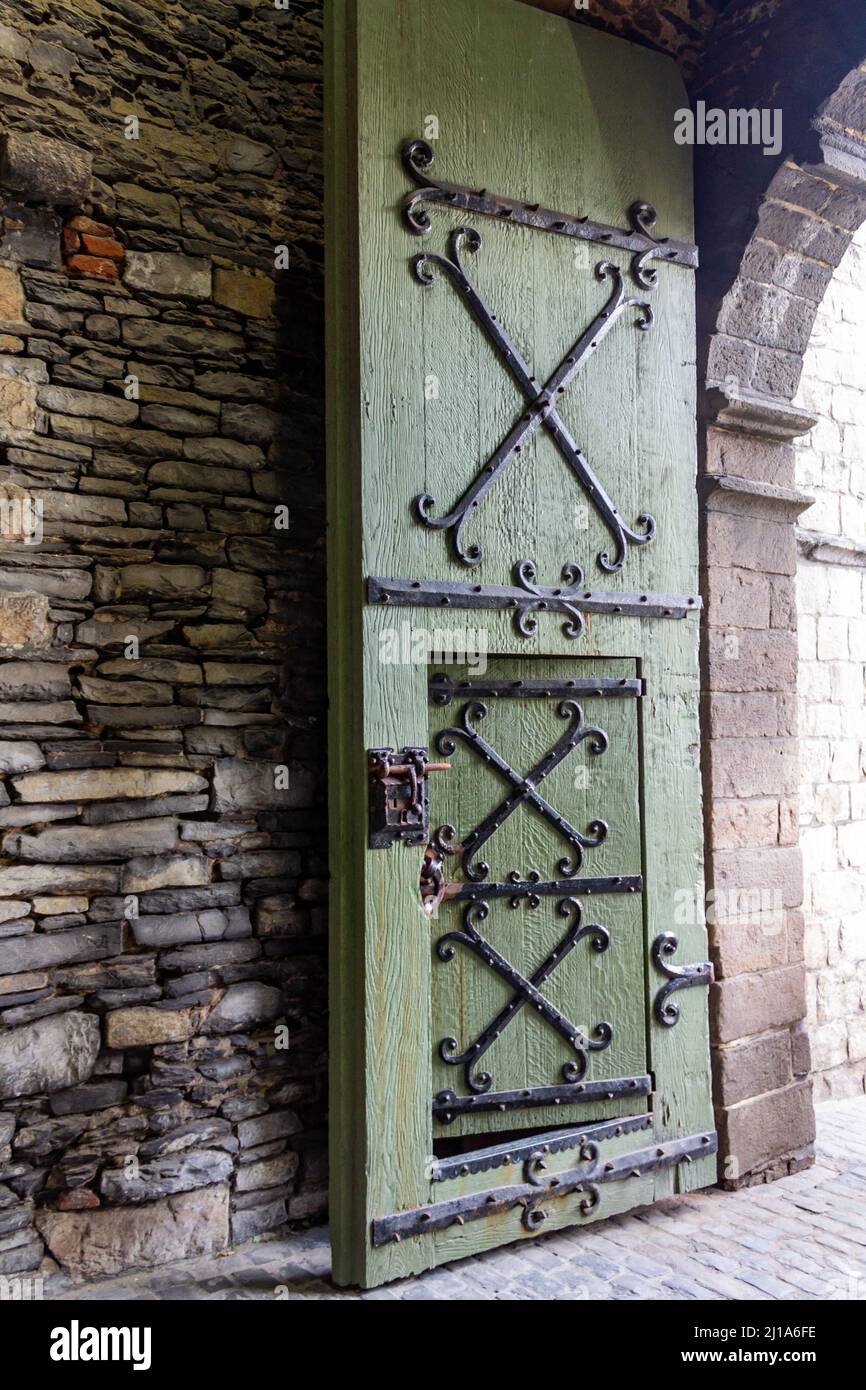 A vertical shot of detail of a wood door in Gravensteen medieval castle ...