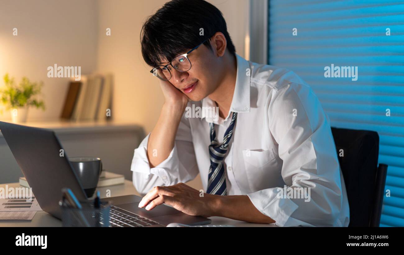 Overwork Concept The office personnel in the loose tie sitting at his ...