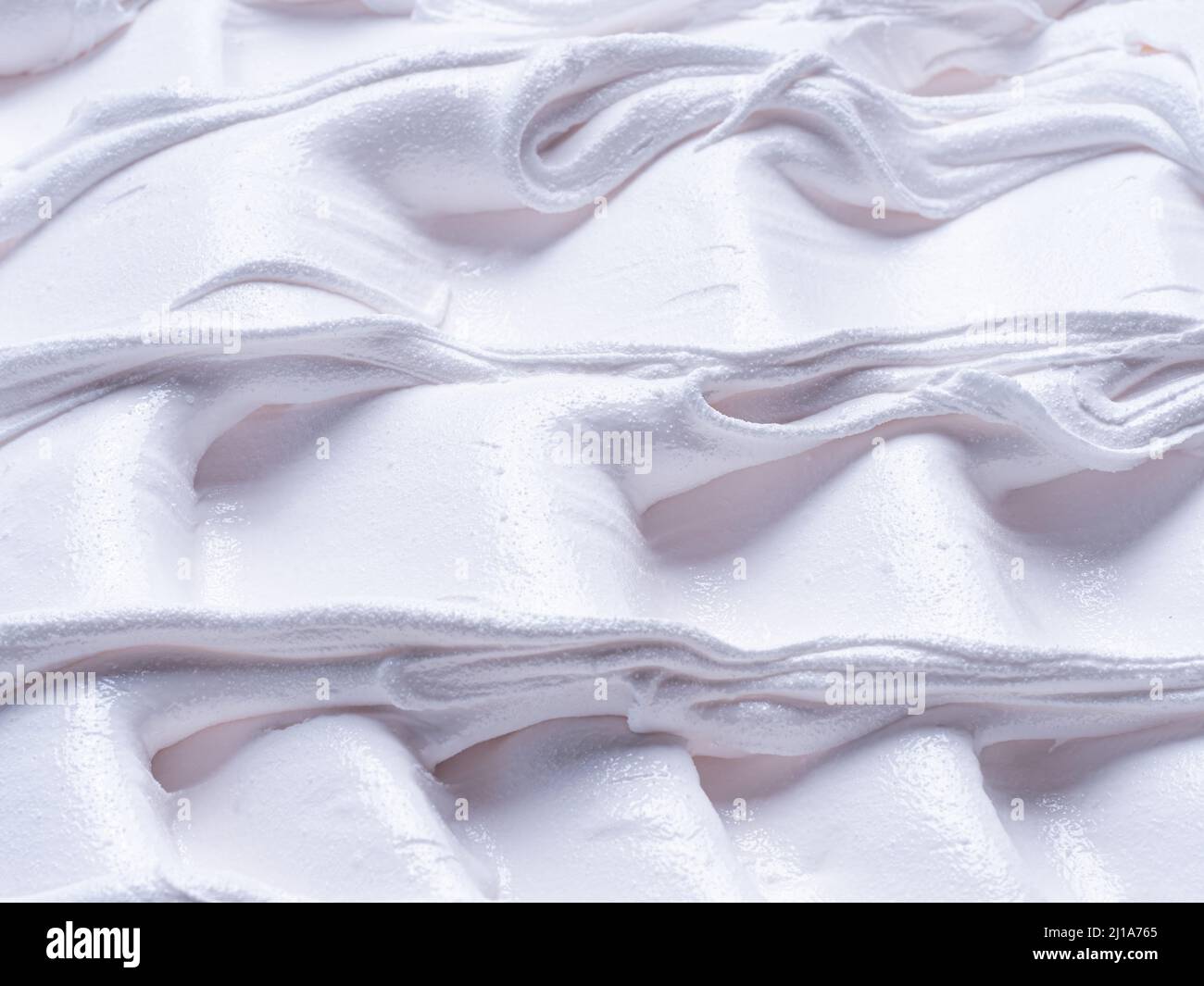 Frozen Lemon flavour gelato - full frame detail. Close up of a white ...