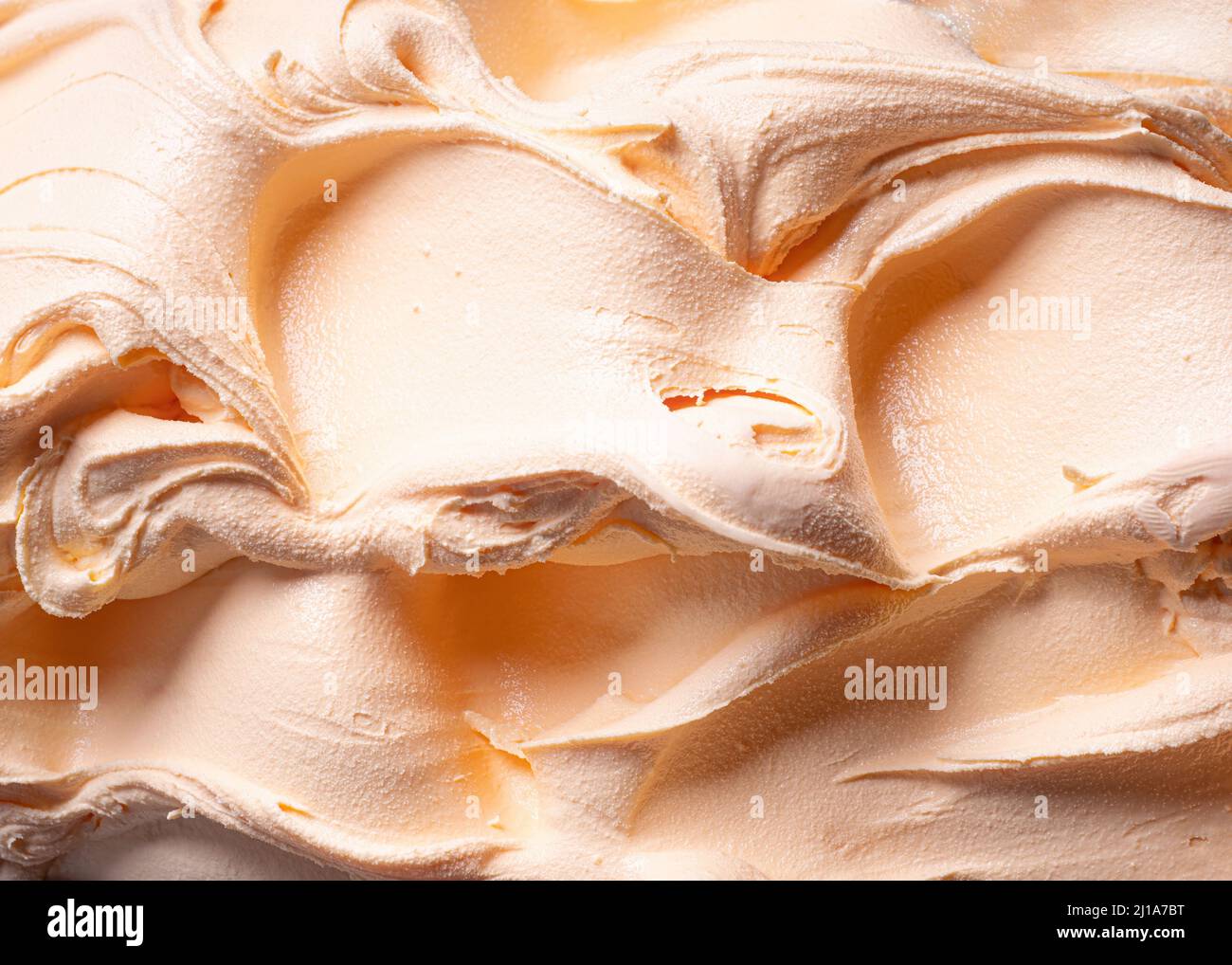 Frozen Tangerine flavour gelato - full frame detail. Close up of a ...