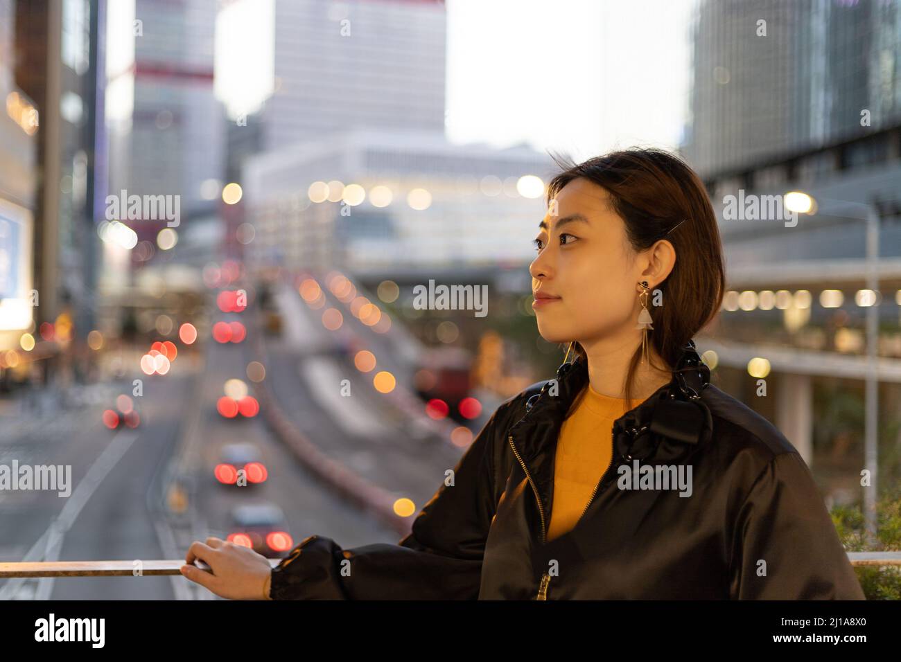 pretty young university student girl in Central, Hong Kong with night ...