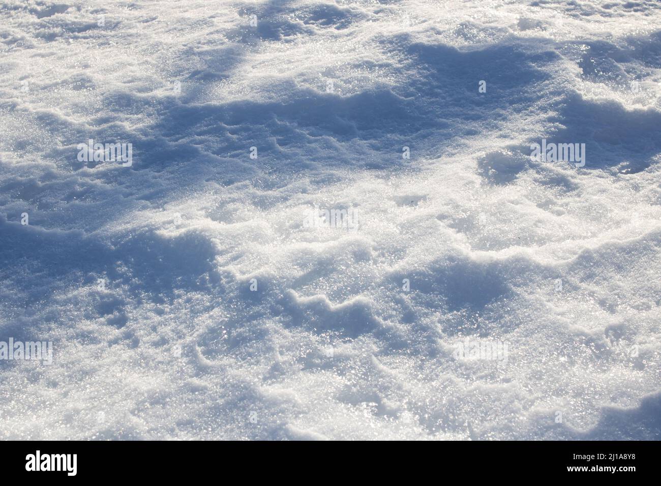 Snowy surface in the sun background or texture Stock Photo - Alamy