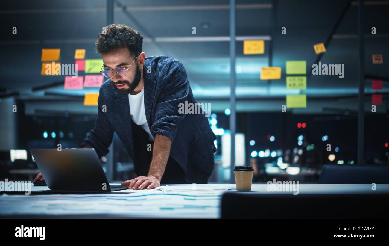Successful Handsome Creative Director Working on Laptop Computer in Big ...