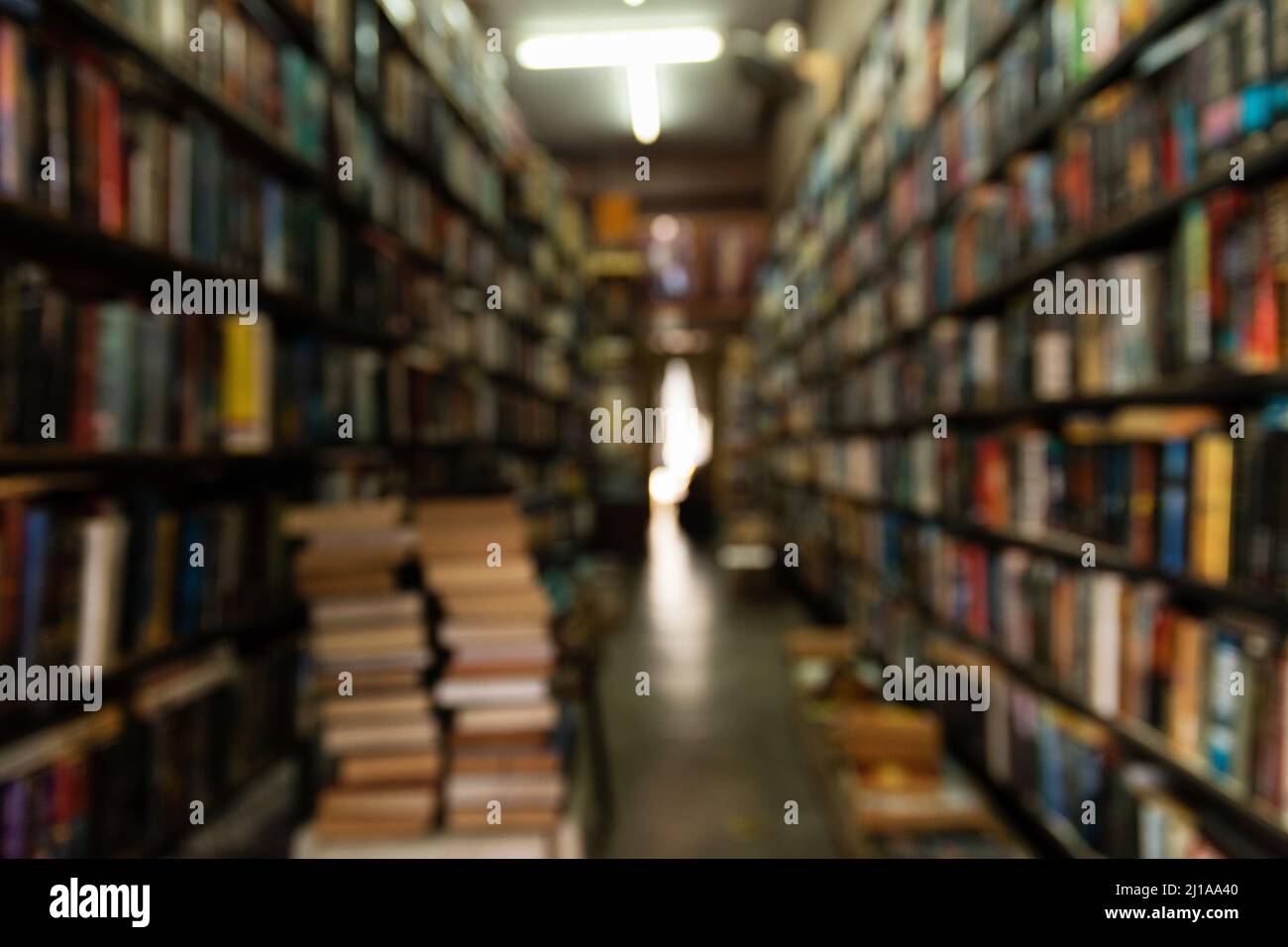 Blurred background of books in the library Stock Photo - Alamy