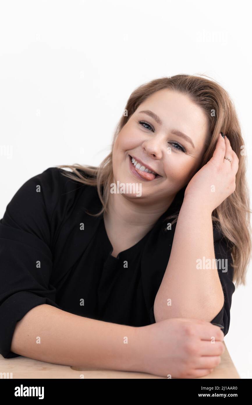 Portrait of smiling happy cute middle-aged fat plus-size woman wearing ...