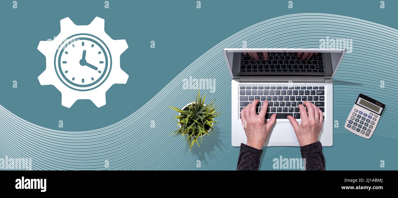 Top view of hands using laptop with symbol of productivity concept ...