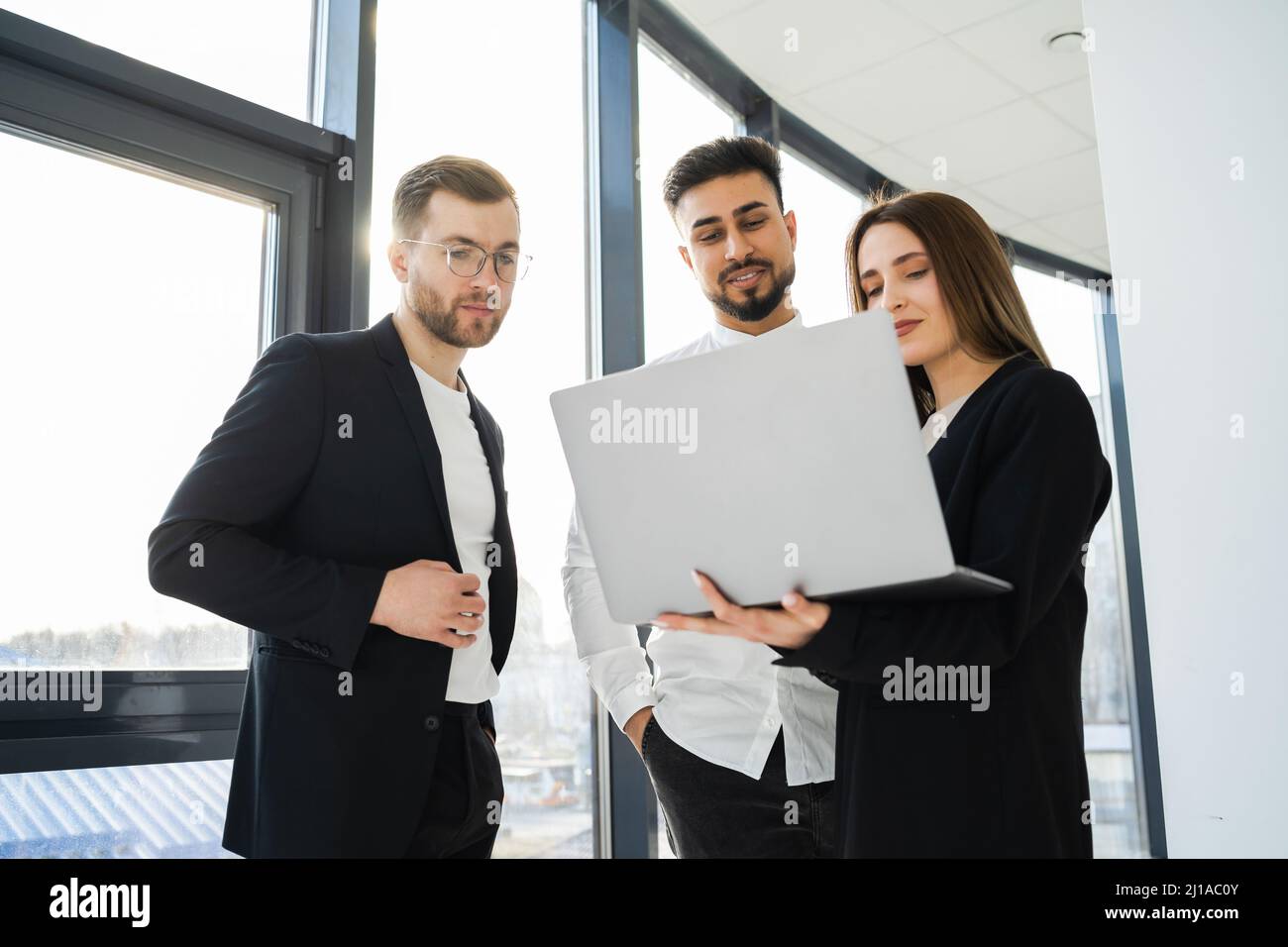 Group coworkers watching laptop hi-res stock photography and images - Alamy