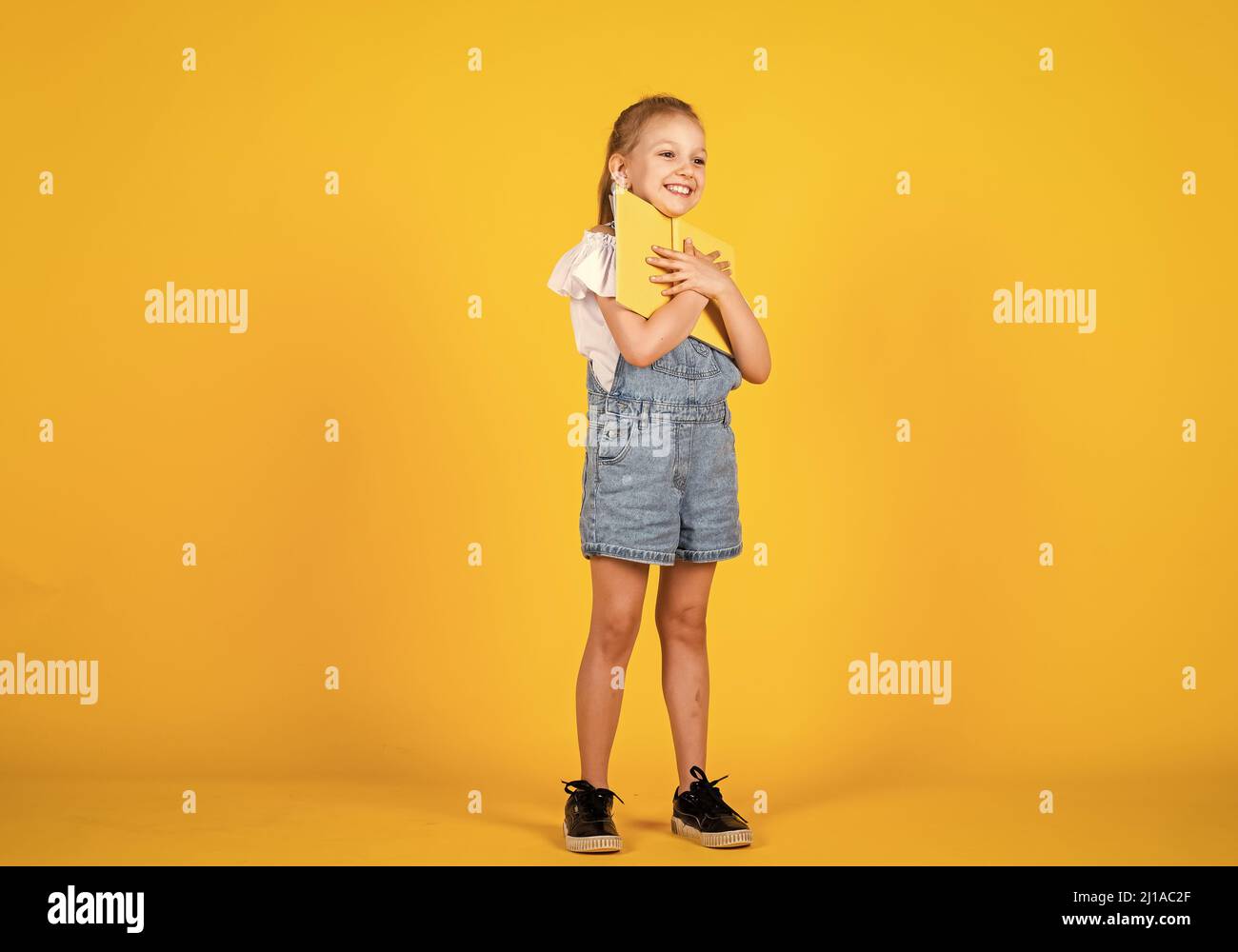 happy child with notebooks ready for study, lesson Stock Photo - Alamy