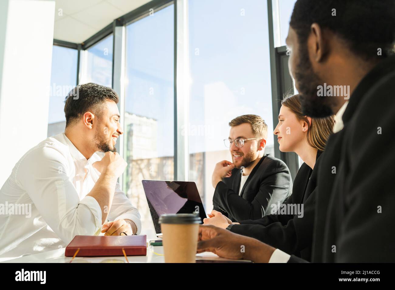Group of office workers holding a meeting Stock Photo - Alamy