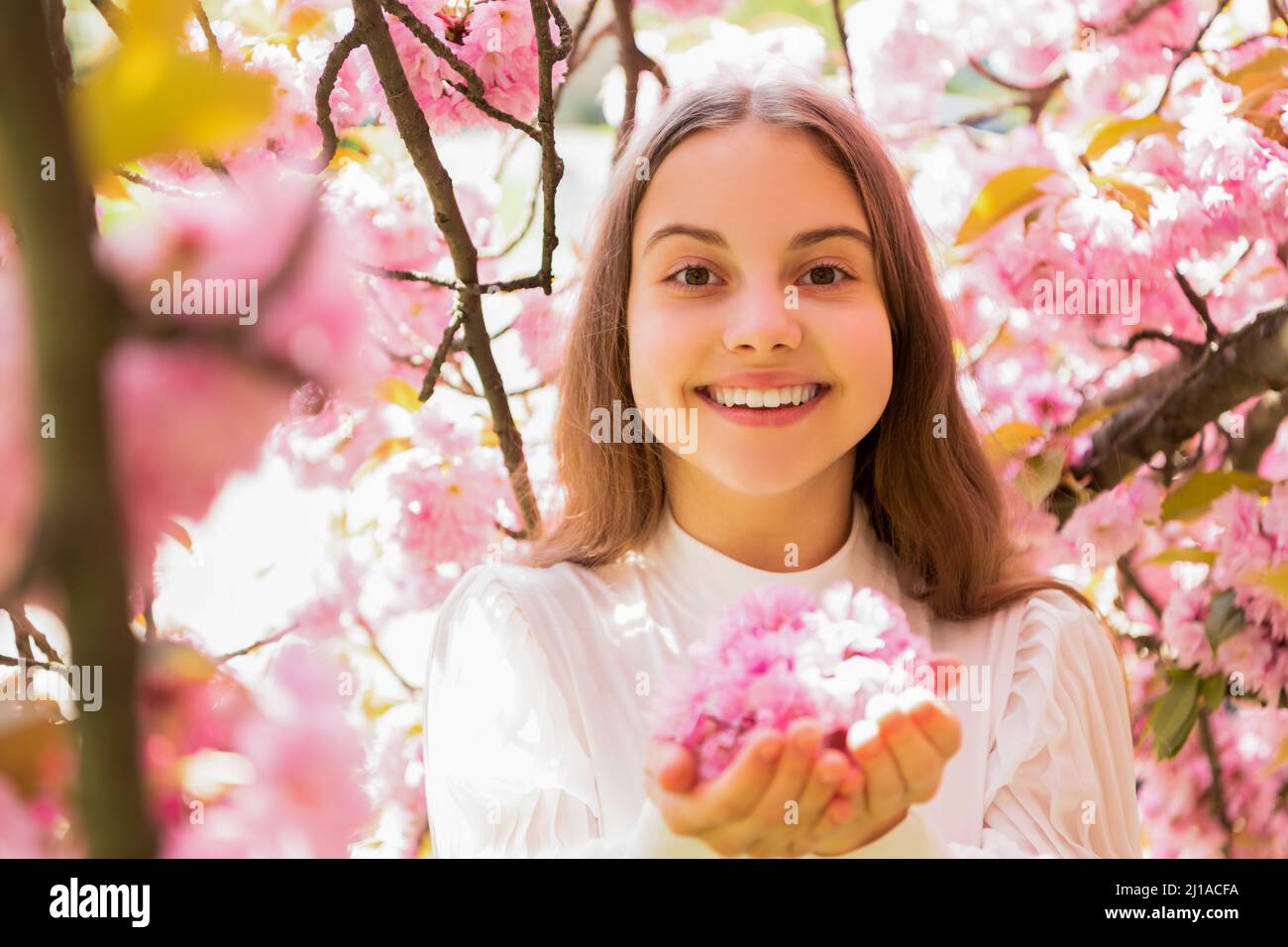 happy kid at sakura flower bloom in spring Stock Photo - Alamy