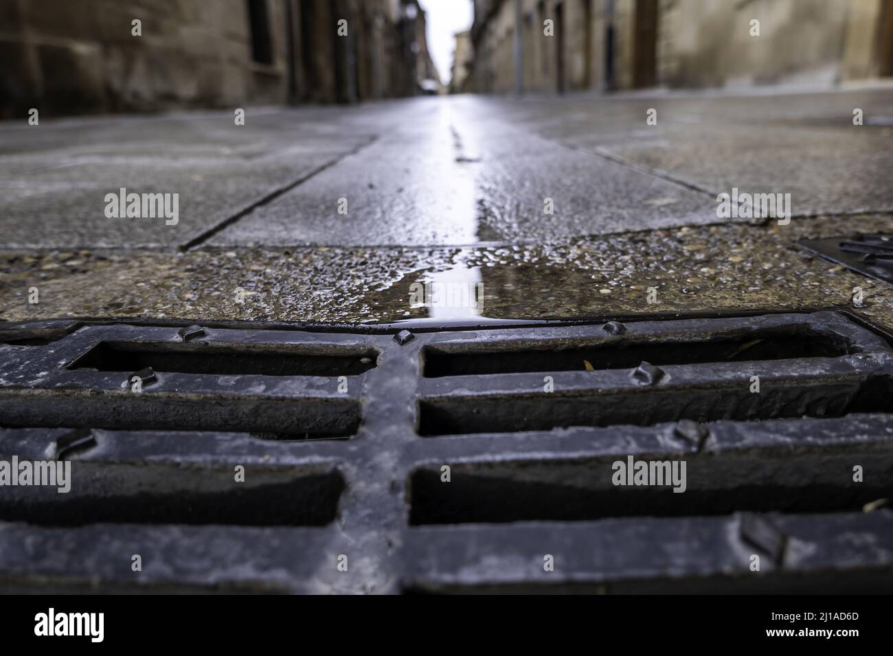 Wet stone street in old town, construction and architecture Stock Photo ...