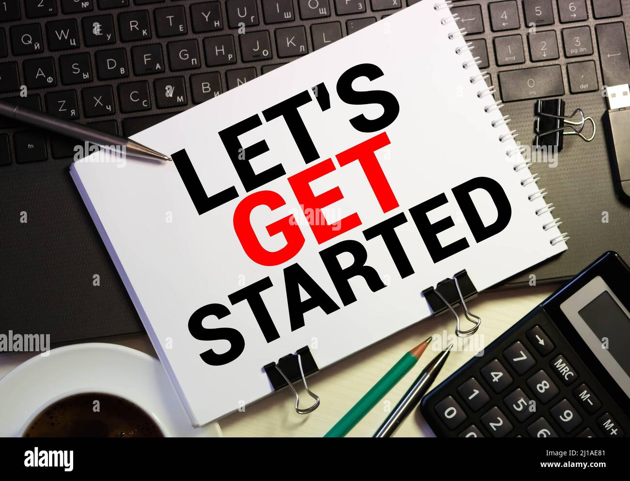 Human hand writing let's get started on whiteboard Stock Photo - Alamy